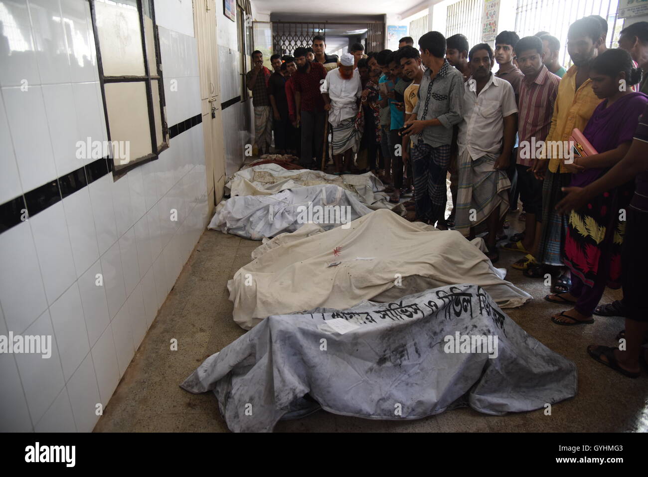Bodies of a fire victims are placed at a makeshift morgue in a hospital ...