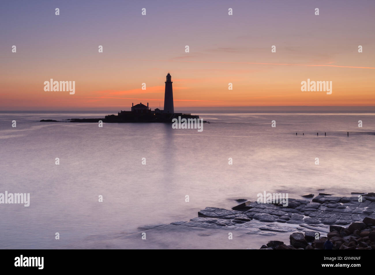 St Mary's Lighthouse at sunrise with rocks, Whitley Bay, North East ...