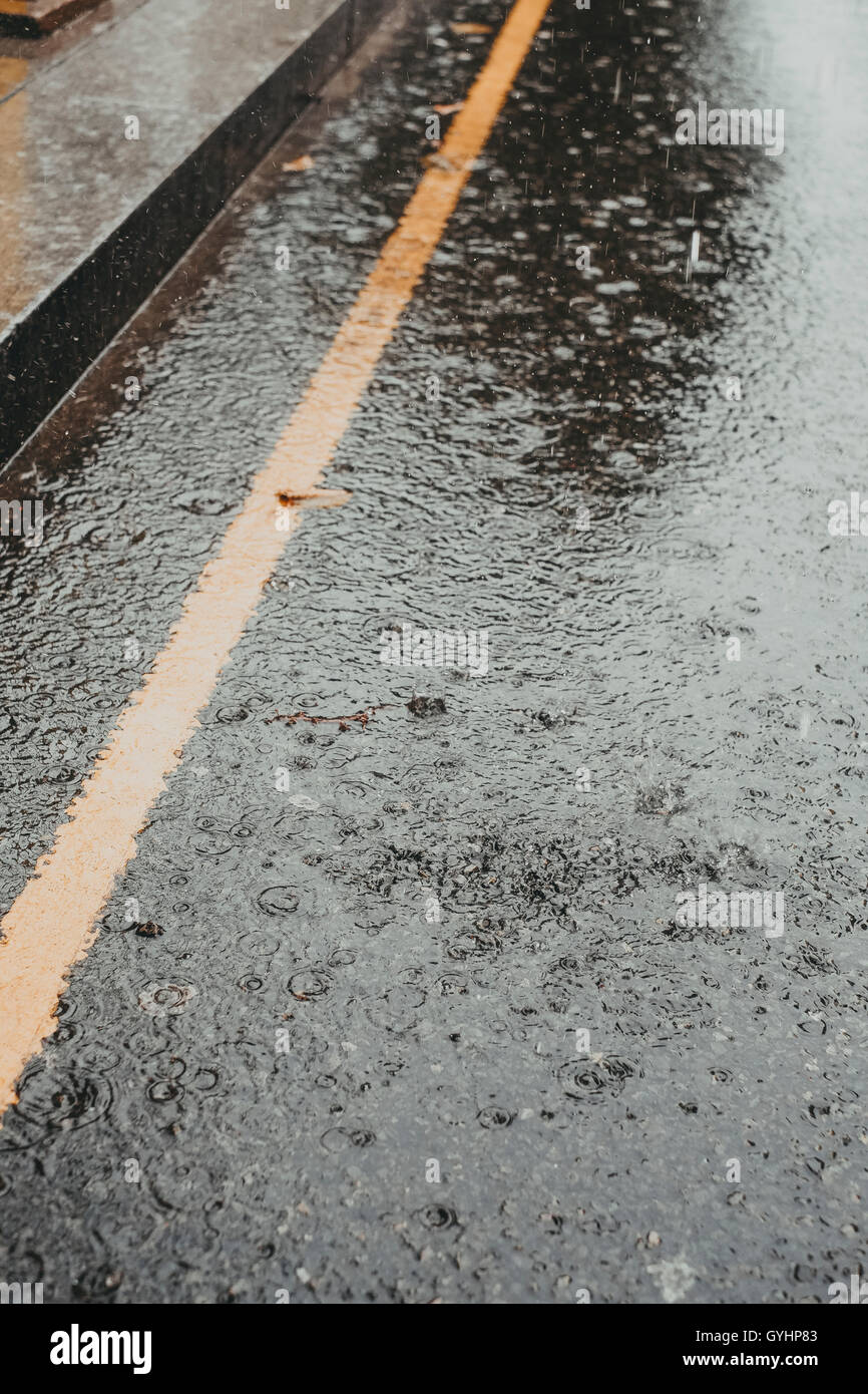 Heavy rain on a road Stock Photo - Alamy