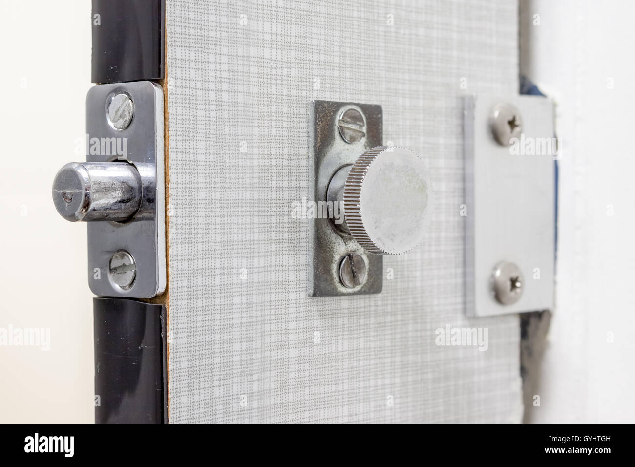 an metal toilet door lock in the bathroom Stock Photo - Alamy