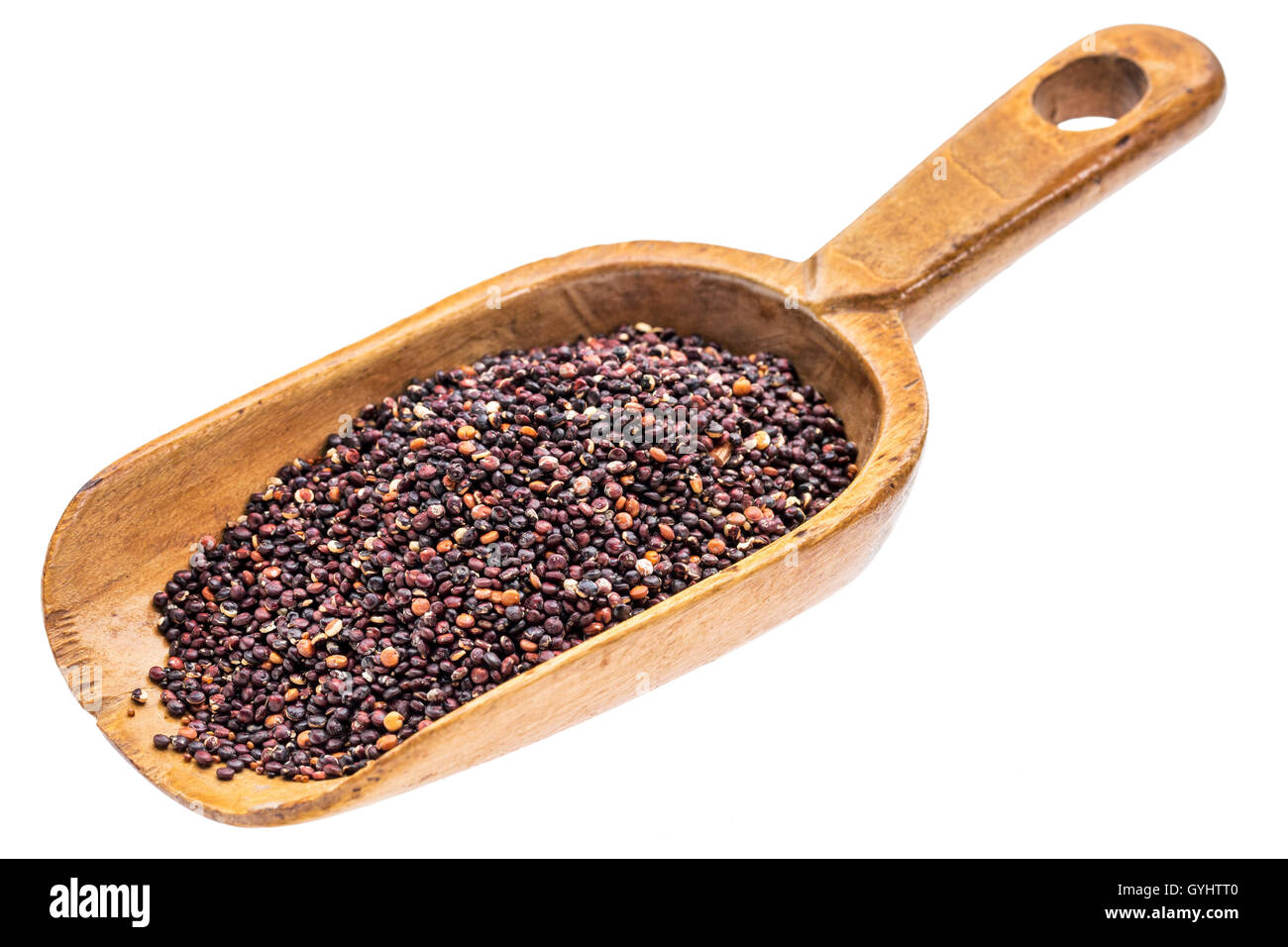 gluten free black quinoa grain on a rustic wooden scoop, isolated on ...