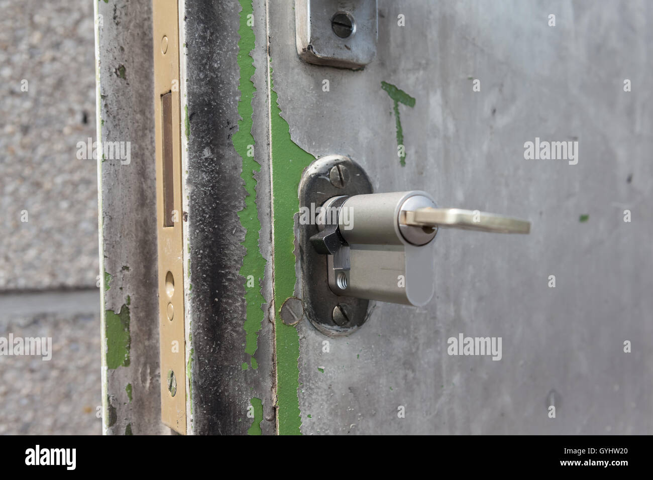 Old metal door with a lock case and cylinder Stock Photo - Alamy
