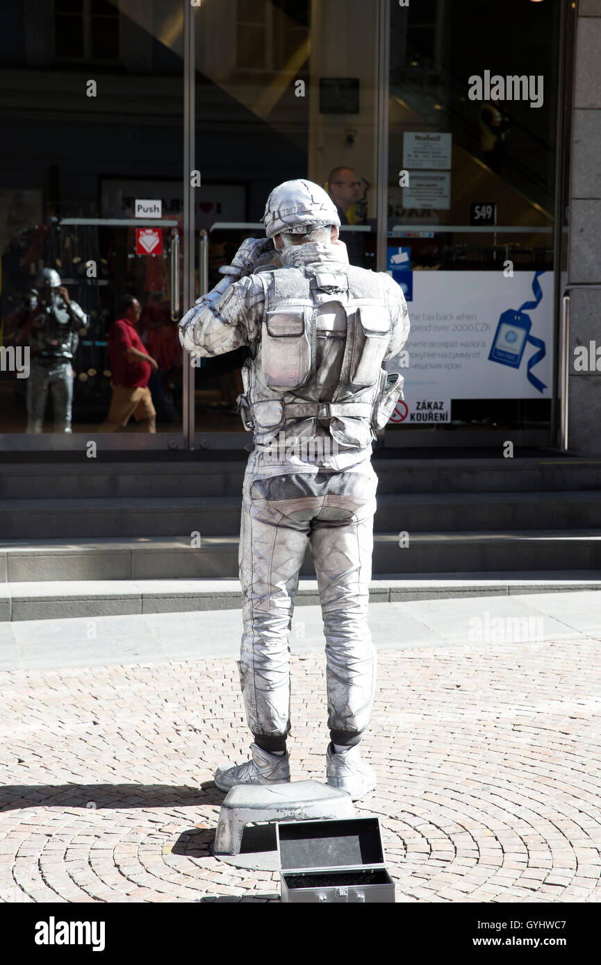 Life statues painted in silver in a street in Prague Stock Photo - Alamy