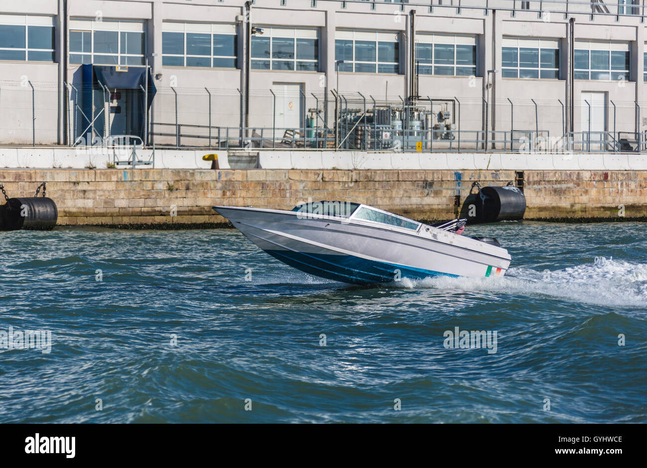 motor boat is floating along the coast Stock Photo - Alamy