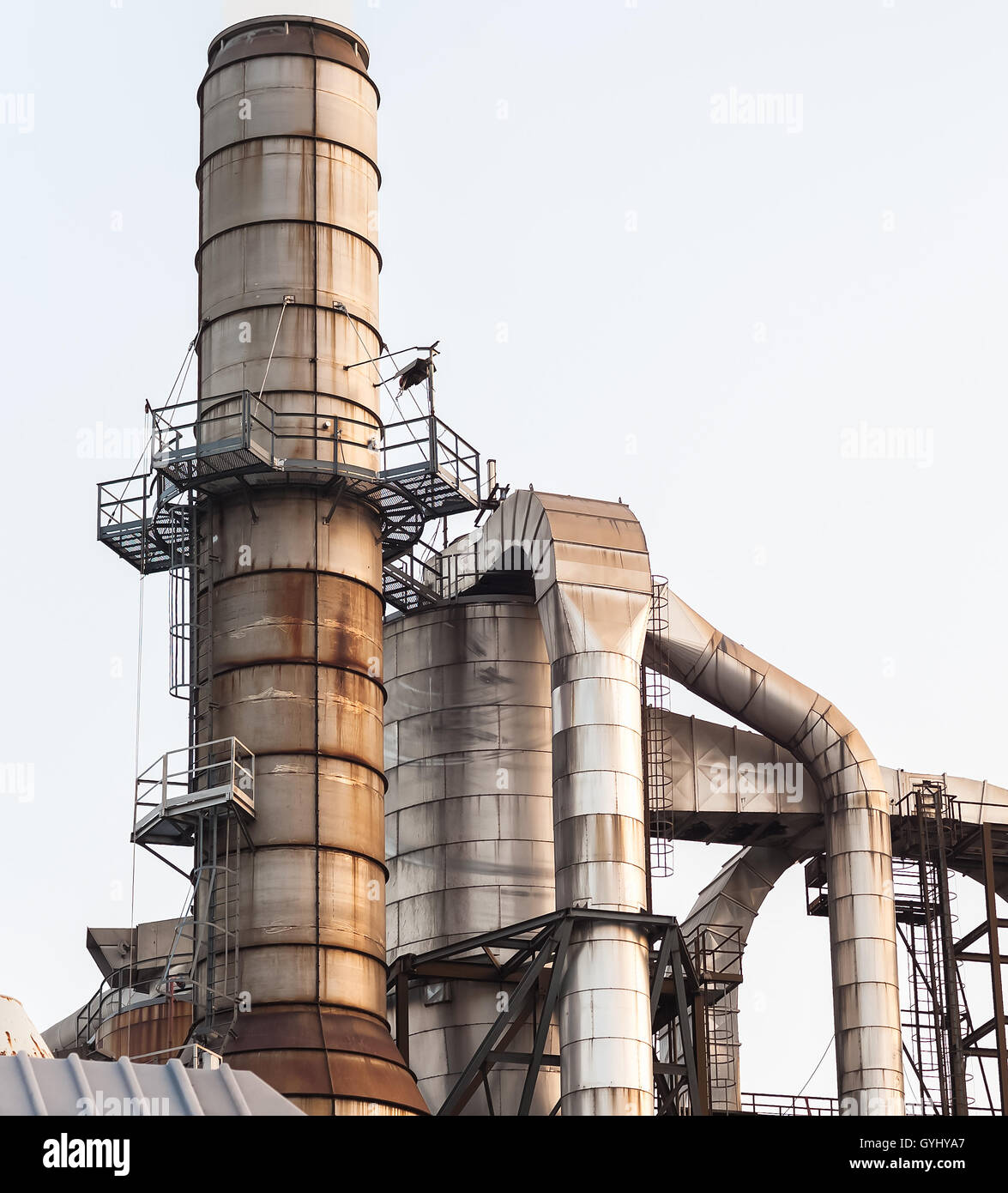 Chemical plant. Silos and smokestacks of a factory Stock Photo - Alamy