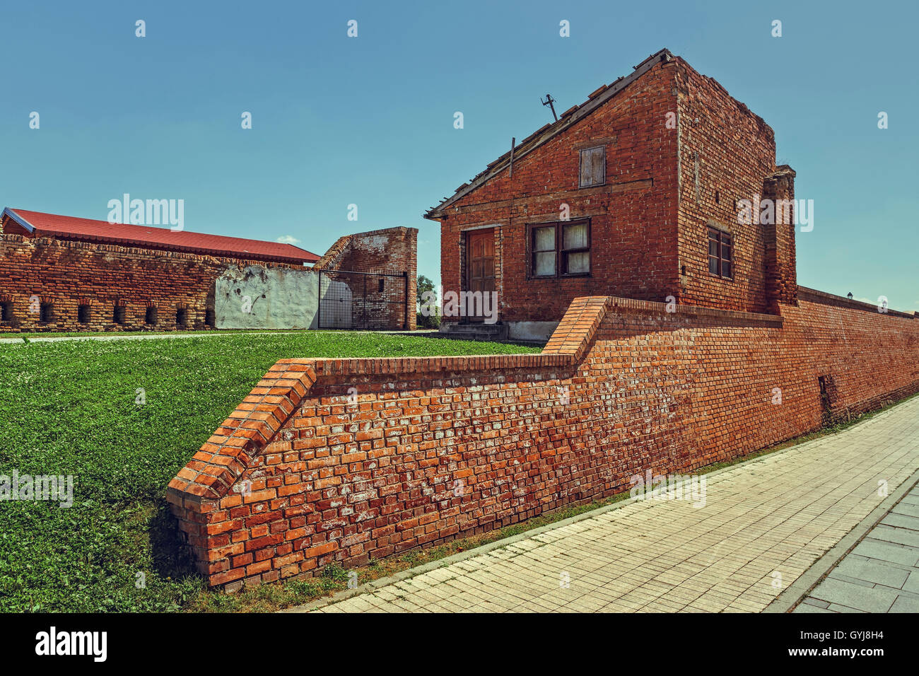 Ancient brick dwelling with fortified walls inside the medieval ...