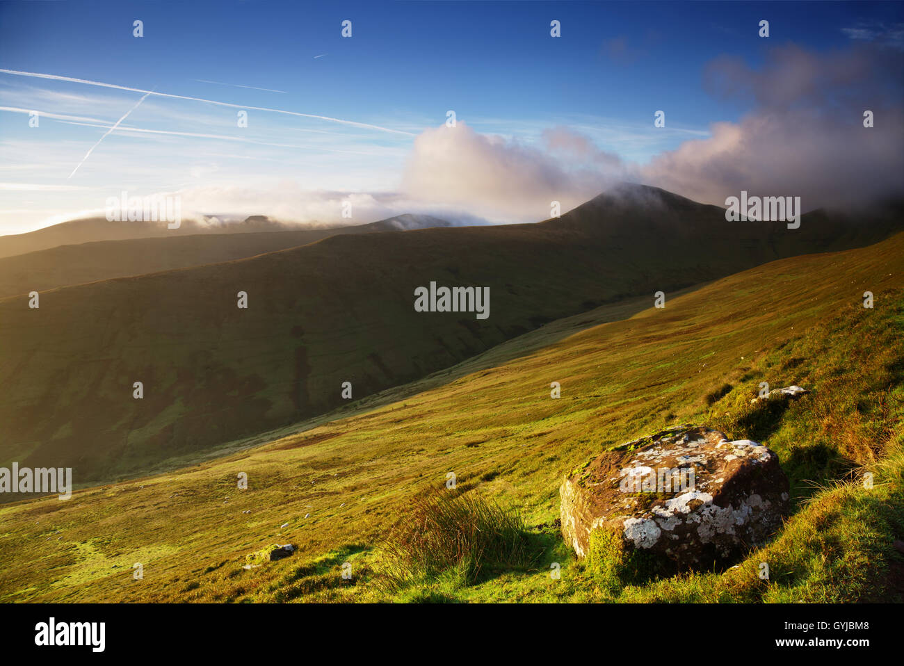 Cribyn from the north ridge of Pen Y Fan lit by early morning sun, with ...
