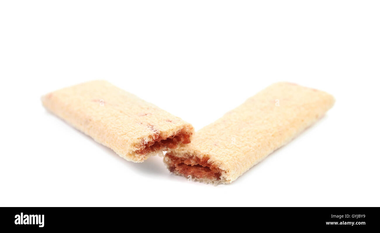 Broken biscuit sticks with filling Stock Photo - Alamy