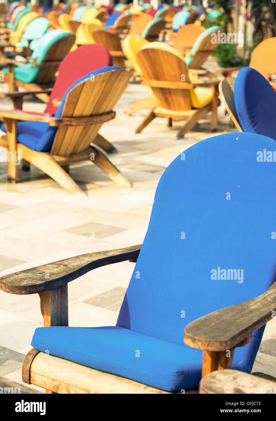 Wooden sun chair on outdoor deck cafe overlooking the Mediterranean Sea ...