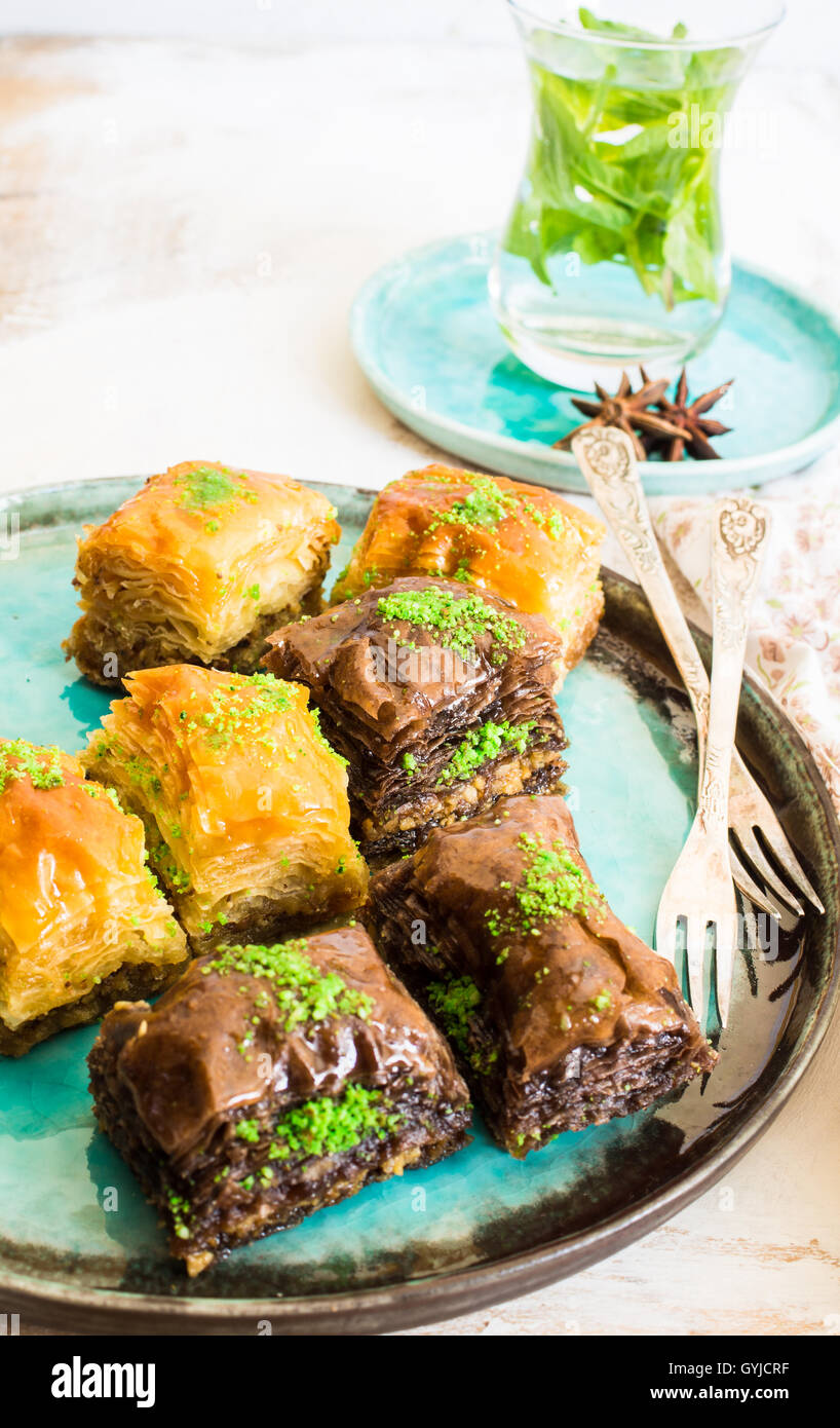 Traditional turkish dessert - mint tea and bakhlava on rustic ...