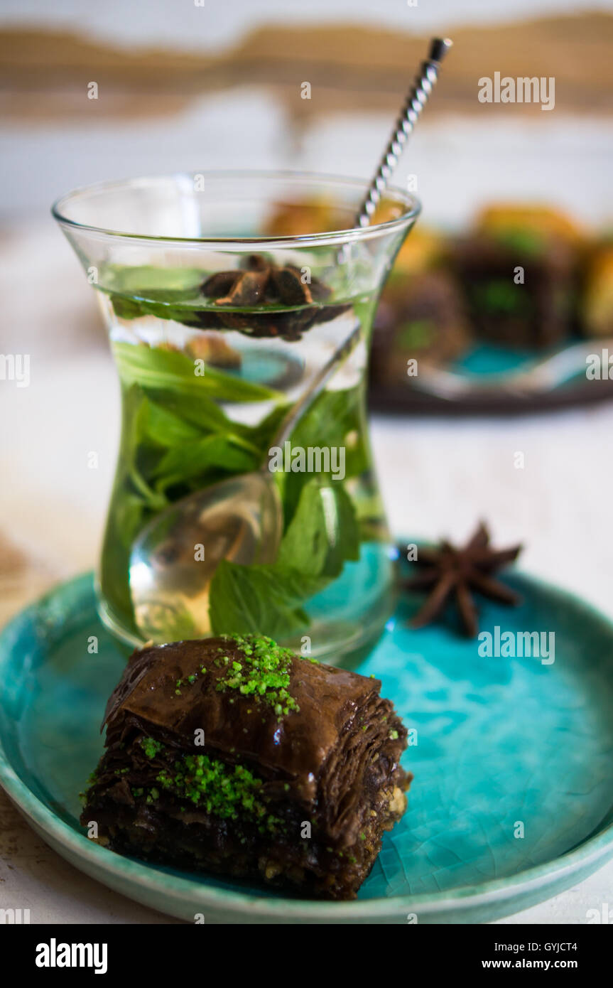 Traditional turkish dessert - mint tea and bakhlava on rustic ...