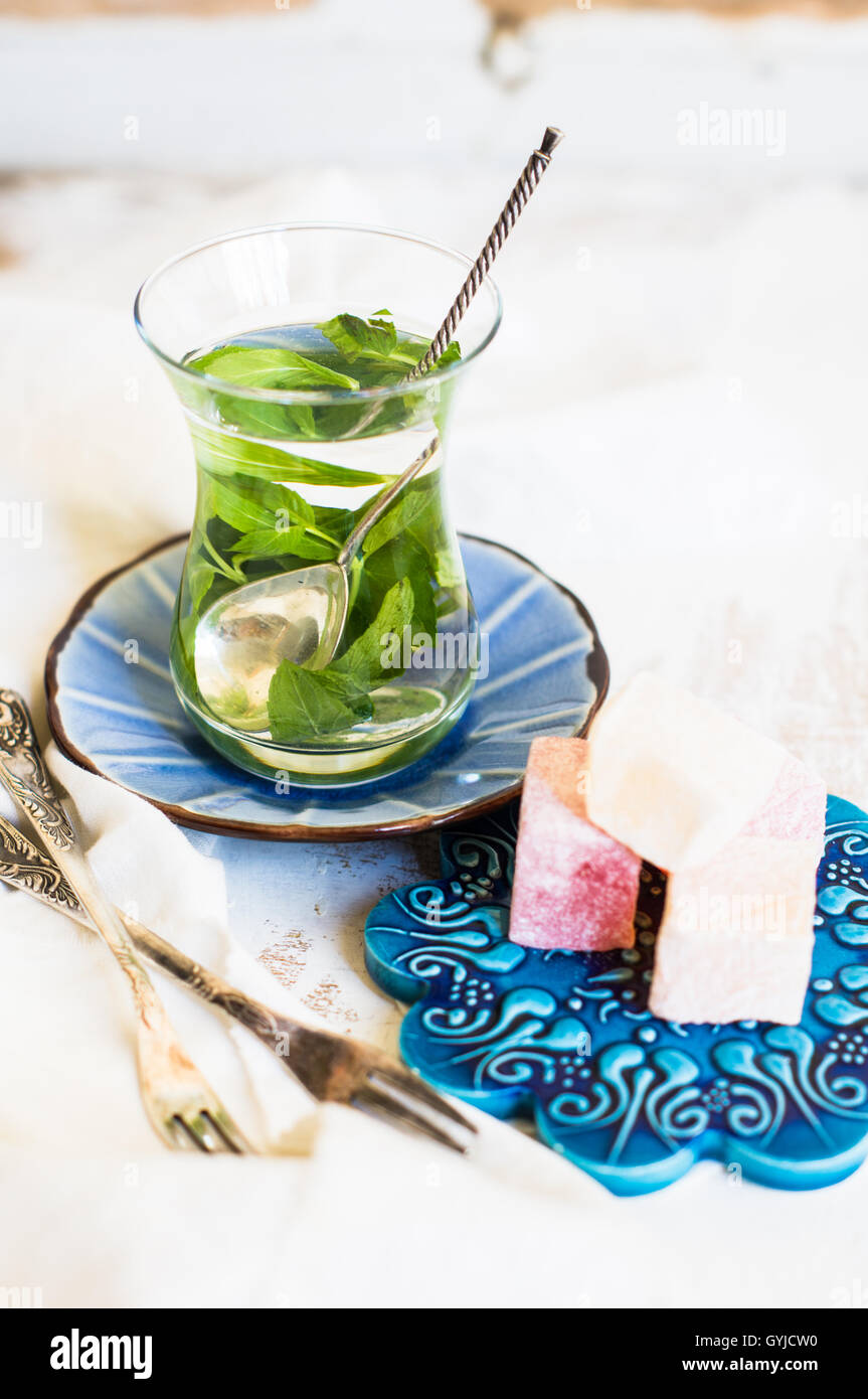 Traditional turkish dessert - mint tea and bakhlava on rustic ...