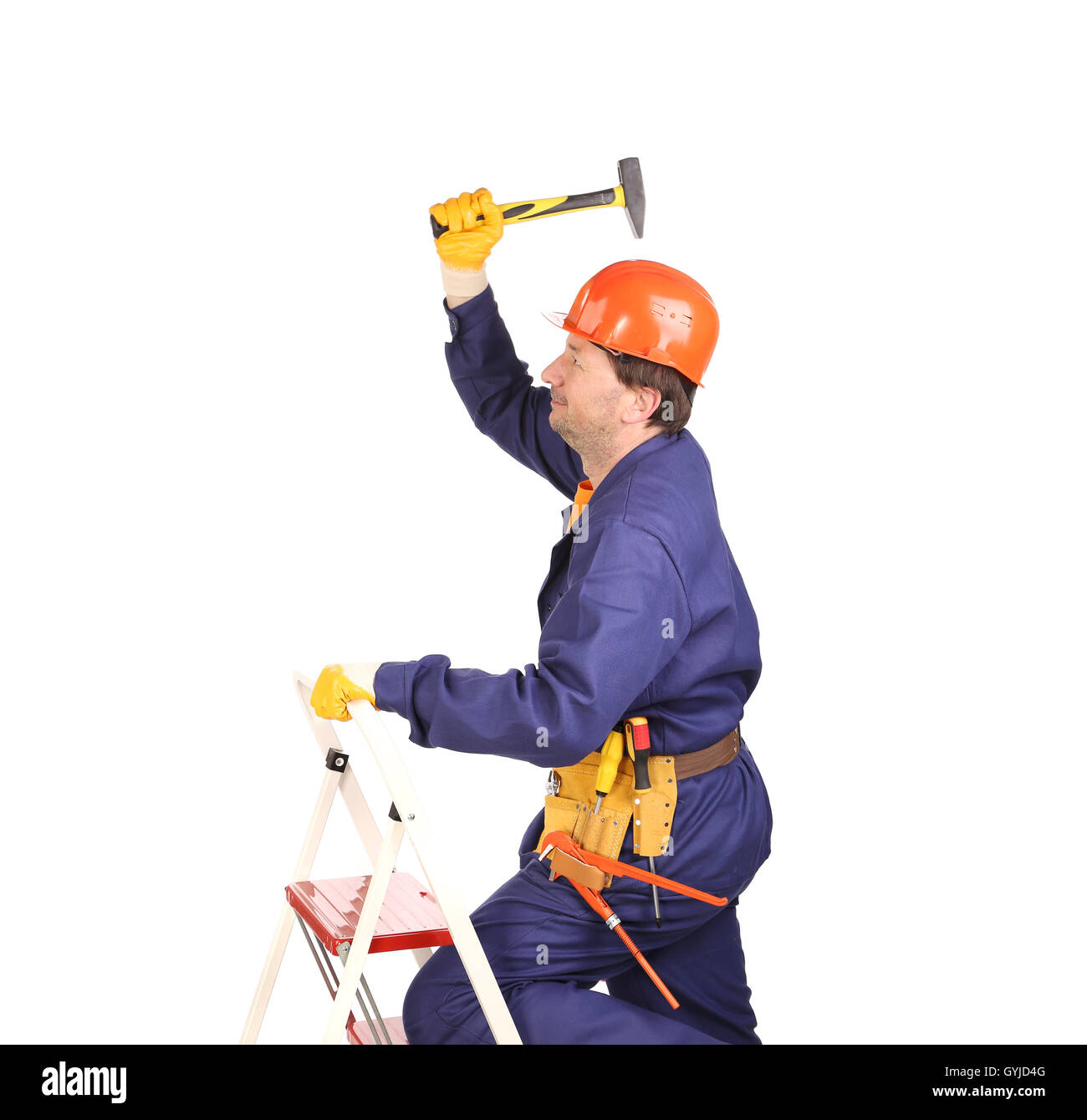 Worker on ladder with hammer Stock Photo - Alamy
