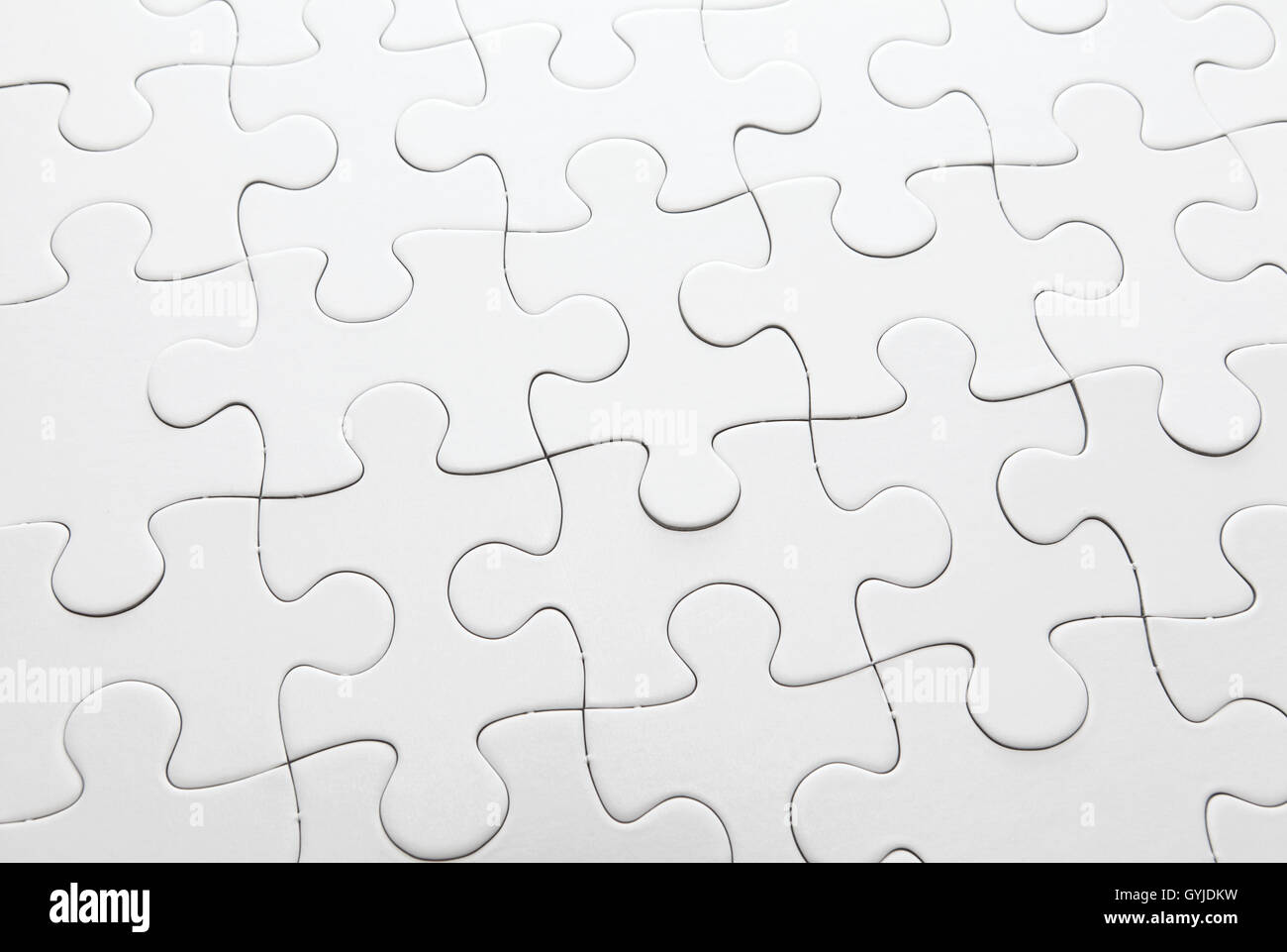 Complete white puzzle Stock Photo - Alamy