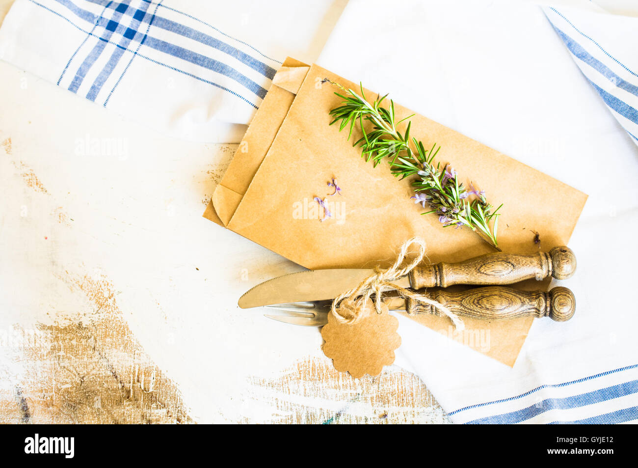 Summer Time Table Setting With Fresh Rosemary Spice On Rustic summer-time-table-setting-with-fresh-rosemary-spice-on-rustic