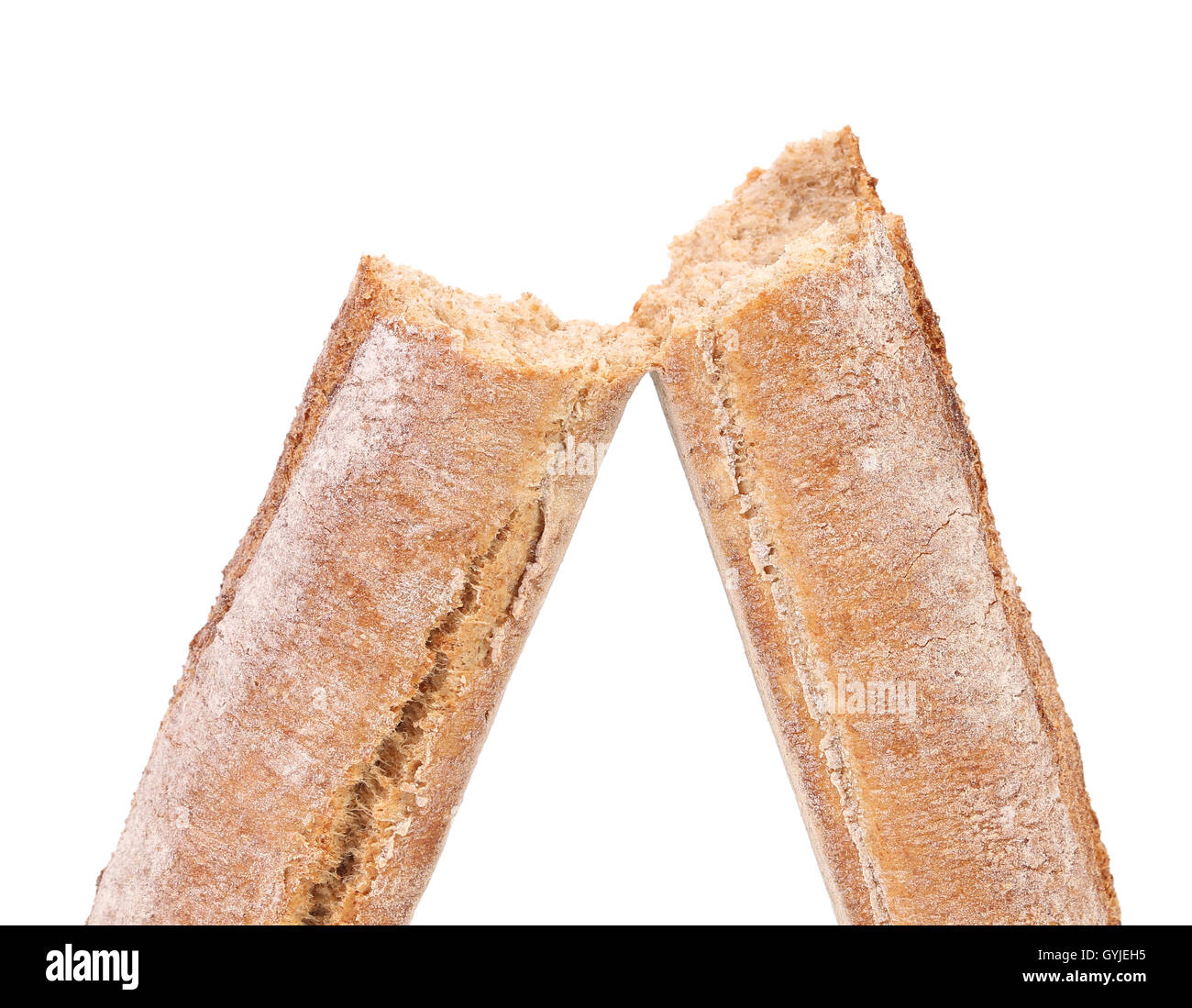 Broken long brown loaf Stock Photo - Alamy