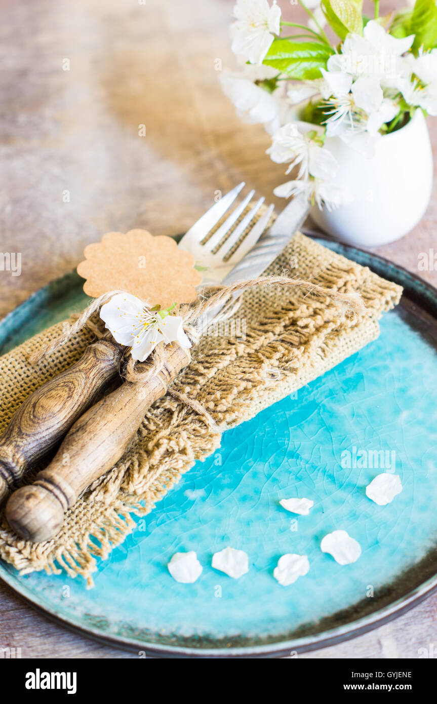 Spring time table setting with cherry blossom and vintage silverware on ...