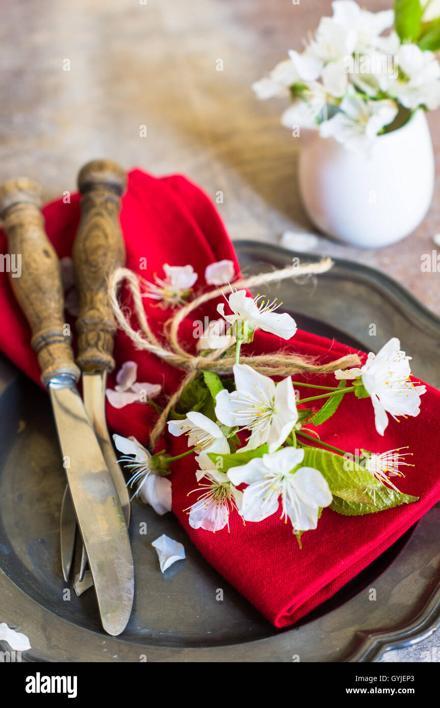 Spring time table setting with cherry blossom and vintage silverware on ...