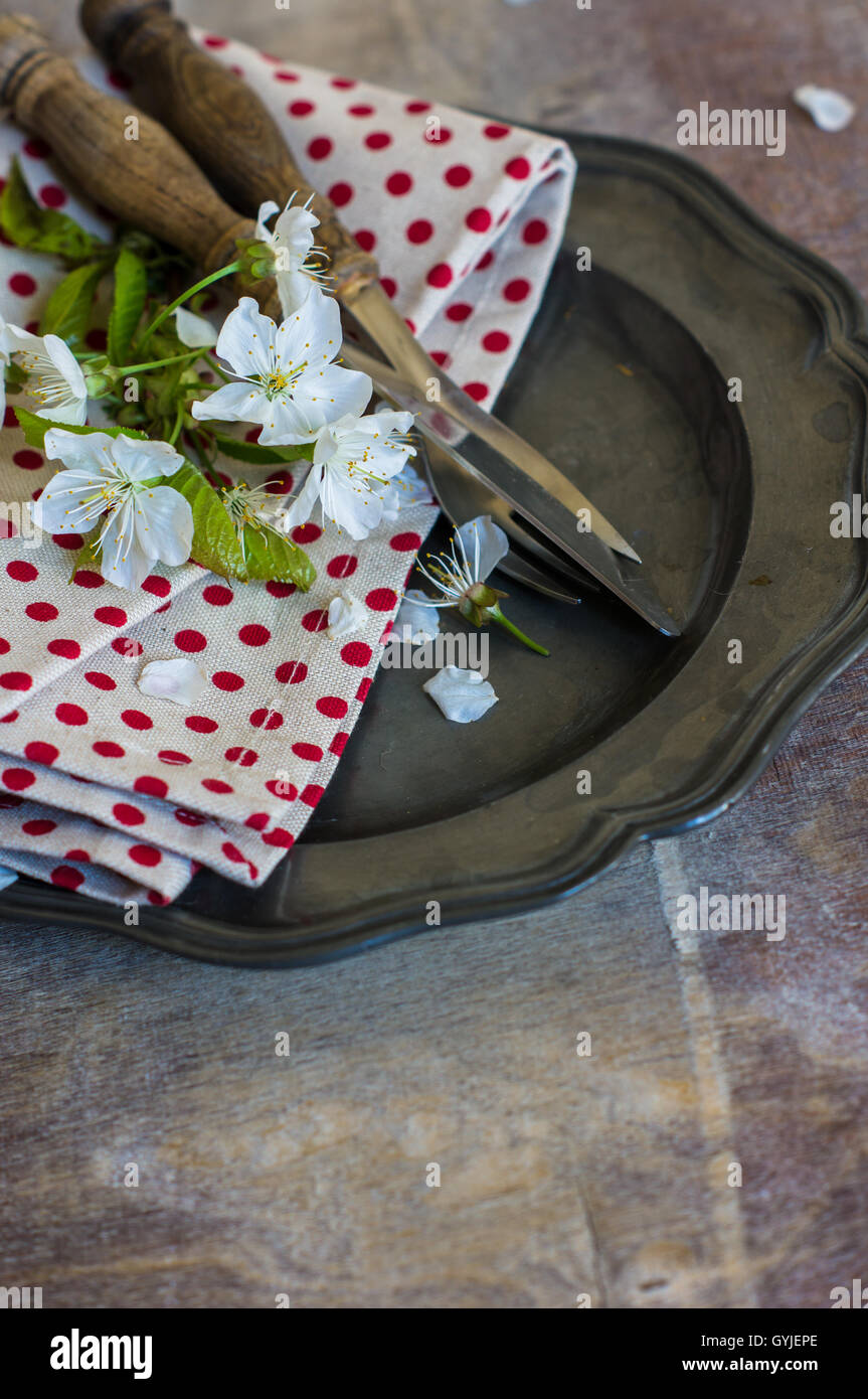 Spring time table setting with cherry blossom and vintage silverware on ...