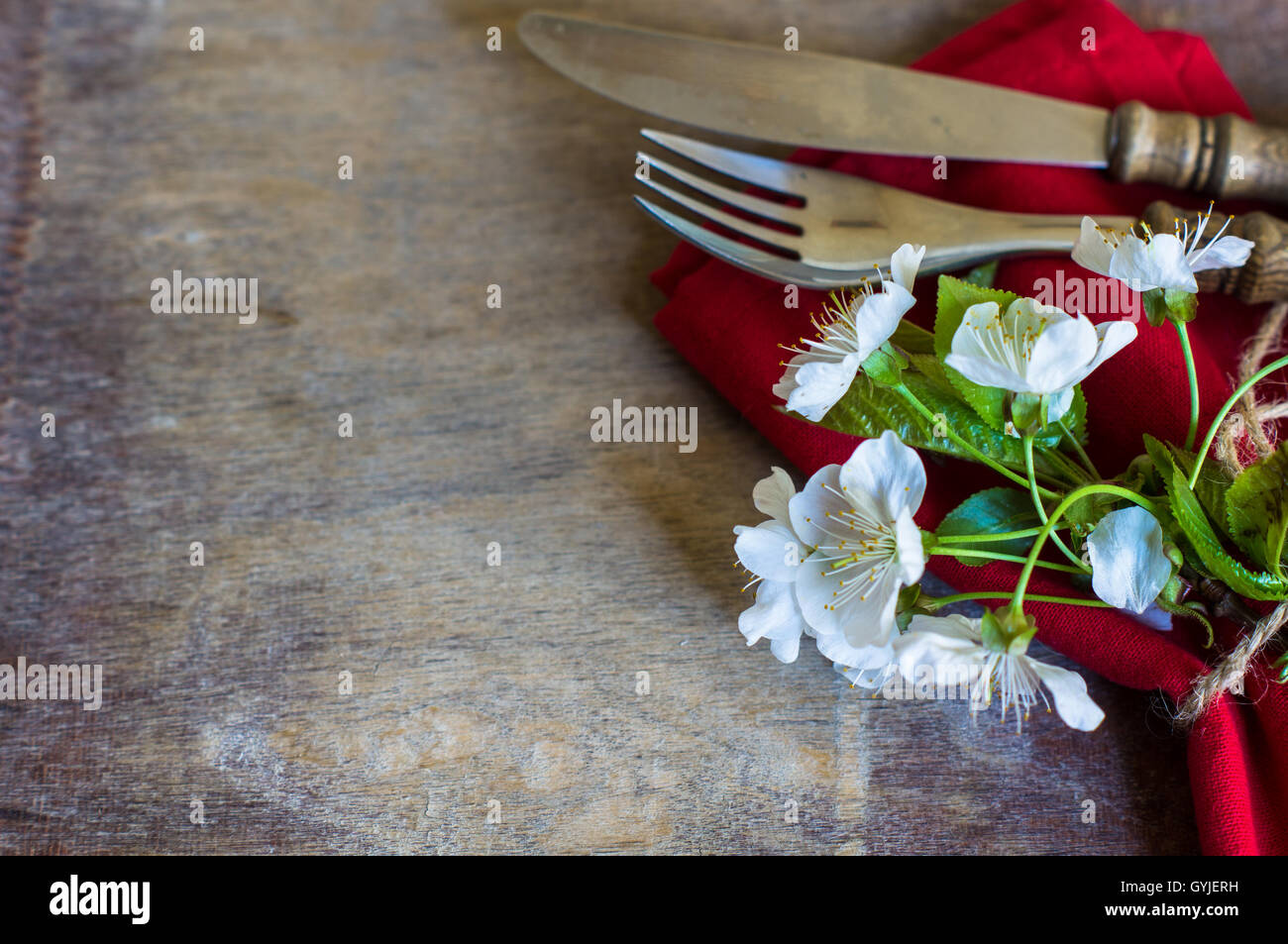 Spring time table setting with cherry blossom and vintage silverware on ...
