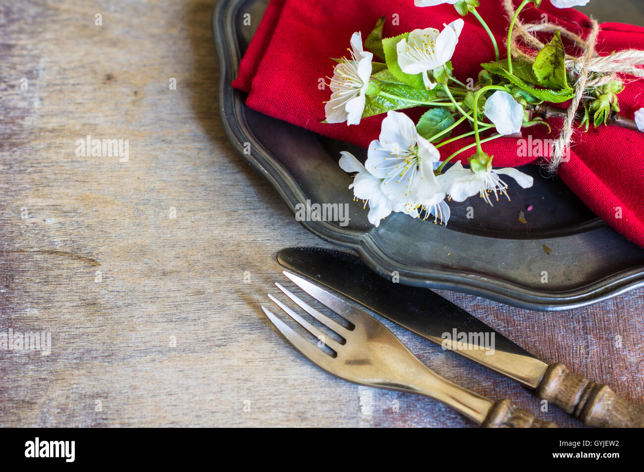 Spring time table setting with cherry blossom and vintage silverware on ...