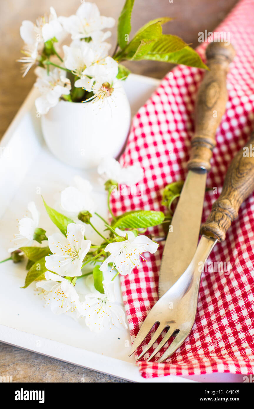 Spring time table setting with cherry blossom and vintage silverware on ...