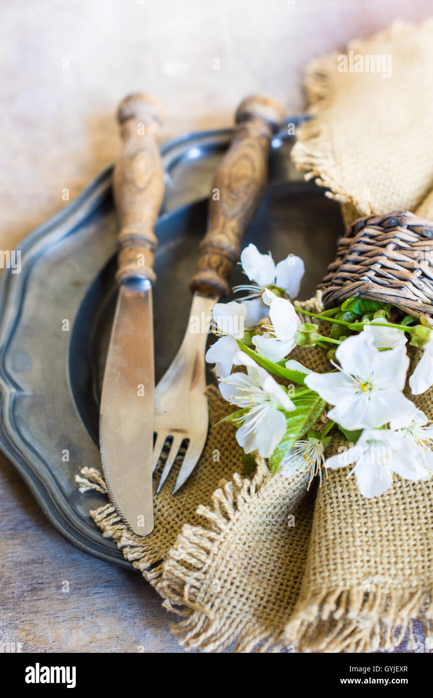 Spring time table setting with cherry blossom and vintage silverware on ...