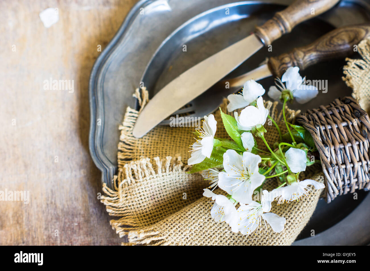 Spring time table setting with cherry blossom and vintage silverware on ...