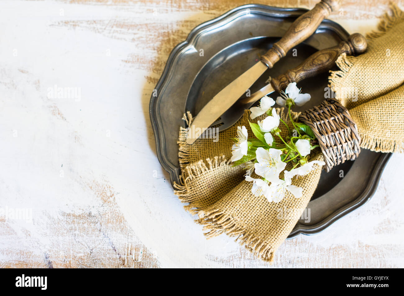 Spring time table setting with cherry blossom and vintage silverware on ...
