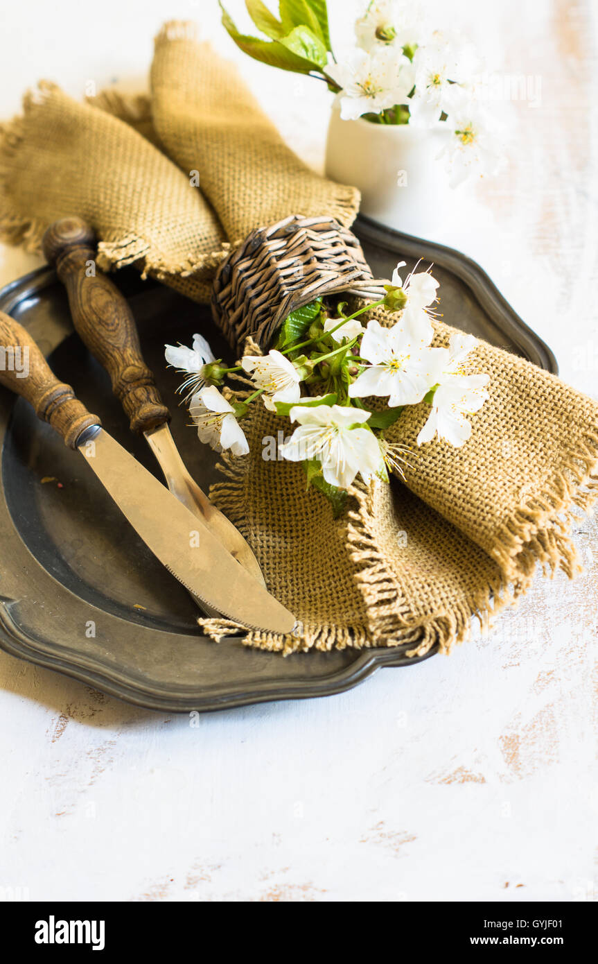 Spring time table setting with cherry blossom and vintage silverware on ...