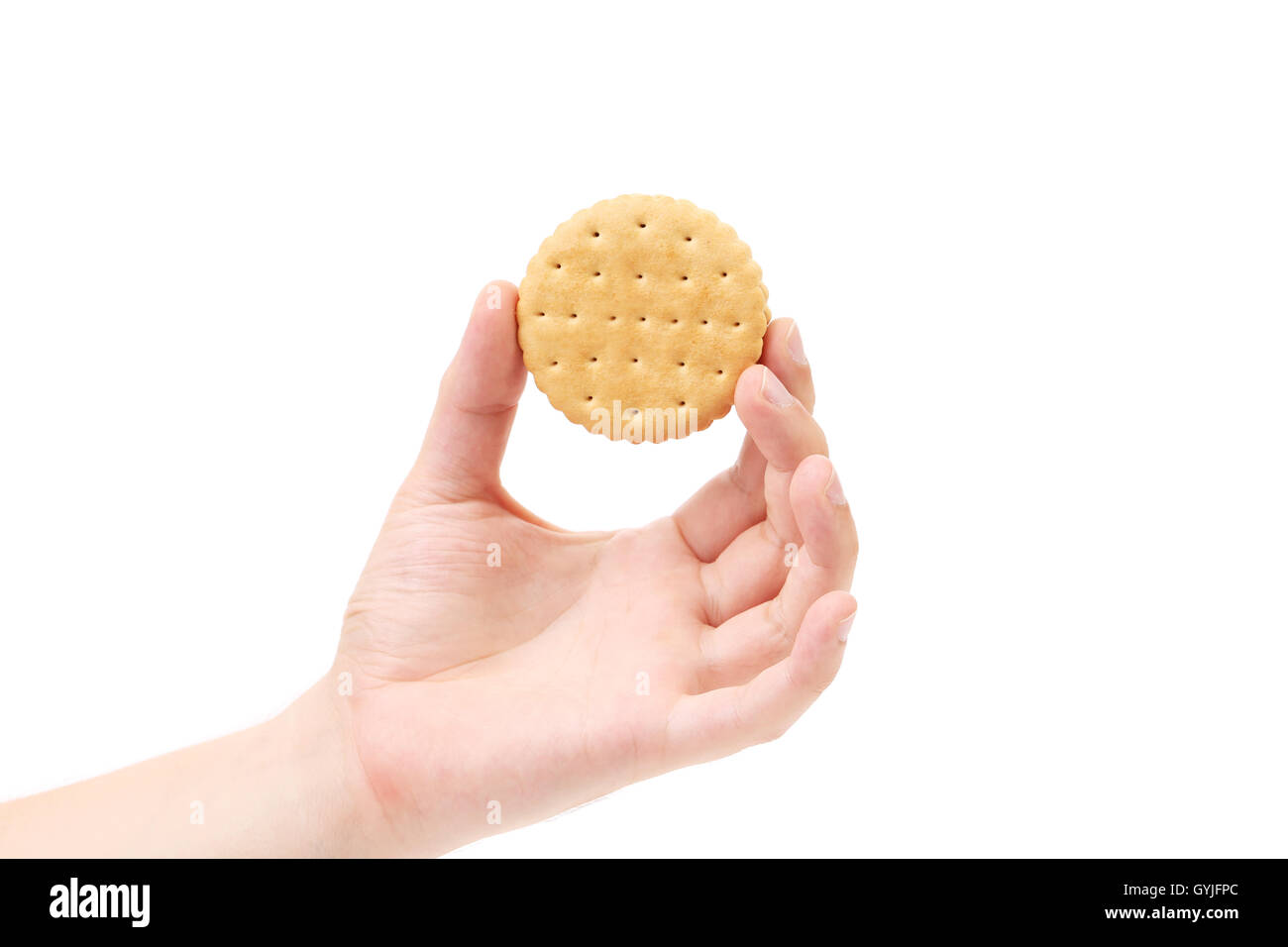 Cookie biscuits with filling in hand Stock Photo - Alamy