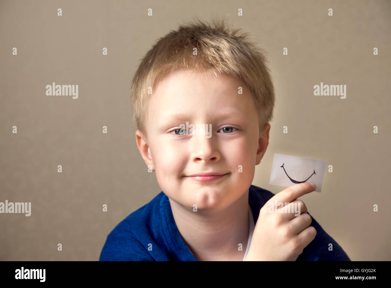 Young boy with paper smile select right positive expressions Stock ...
