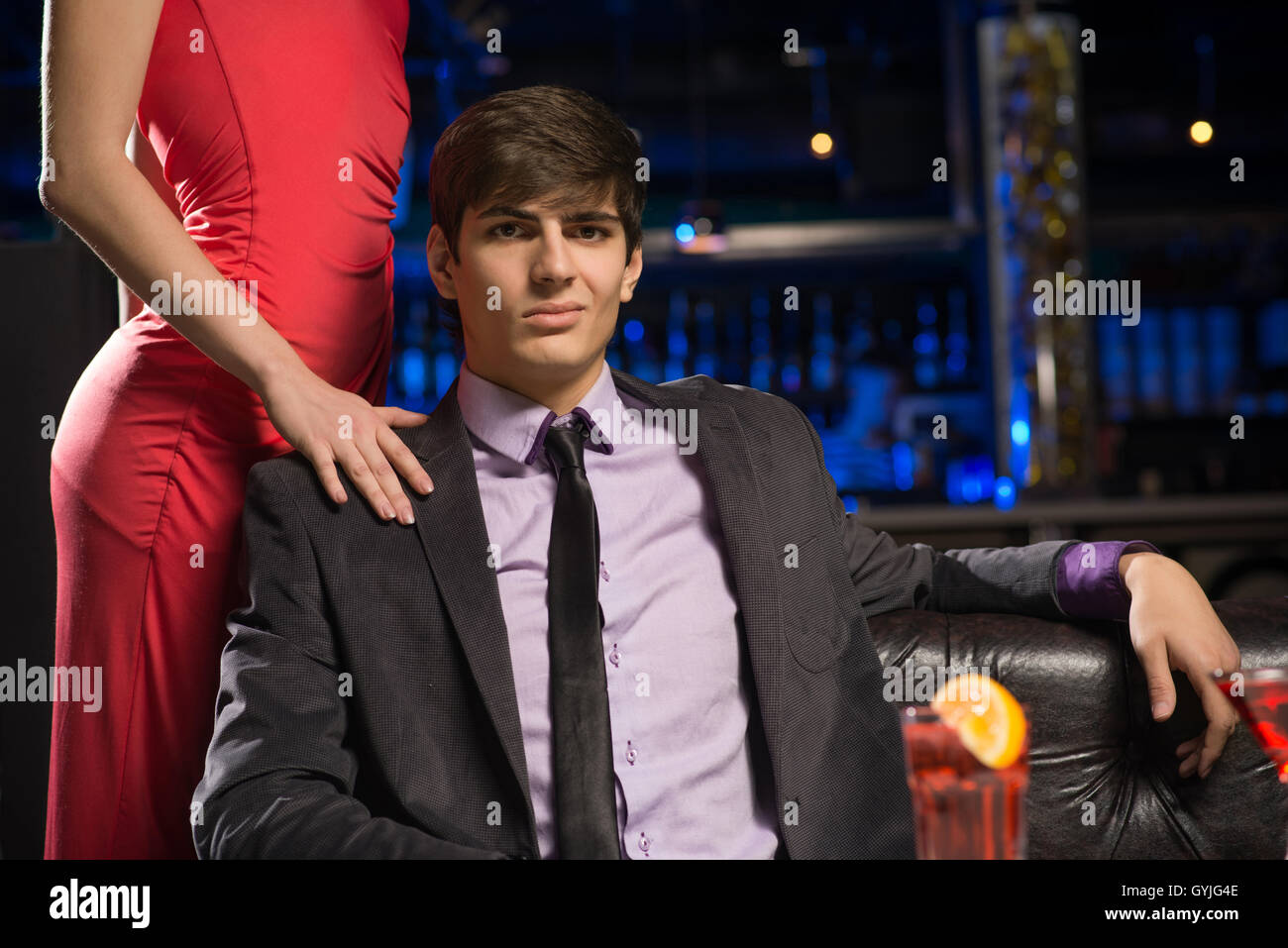 Portrait of a successful man in a nightclub Stock Photo - Alamy