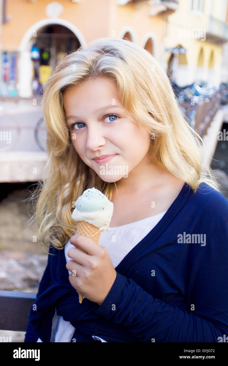 Girl eating ice cream Stock Photo - Alamy
