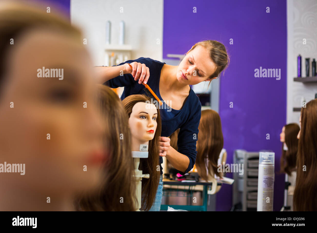 Pretty female hairdresser/haidressing apprentice/student Stock Photo ...
