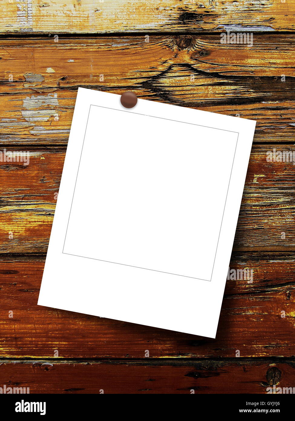 Close-up of one blank square instant photo frame with pin on brown old ...
