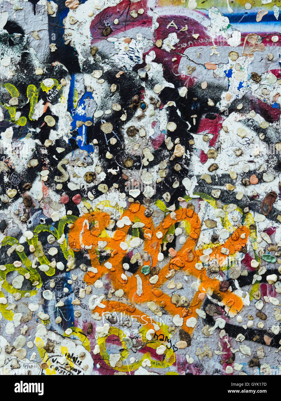 Detail of graffiti and chewing gum covered segment of the Berlin Wall ...