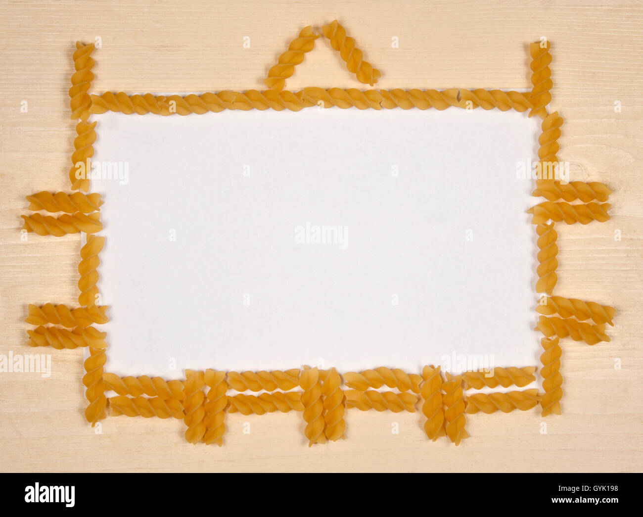 Pasta fusilli frame border background with the place for text. Top view ...