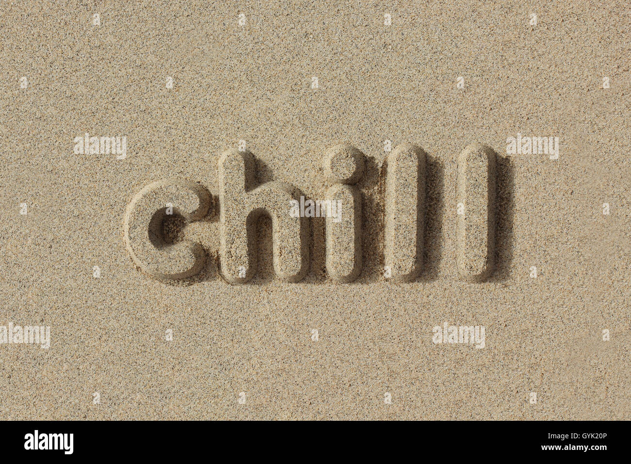 Chill written in sand letters. Very simple and graphic Stock Photo - Alamy