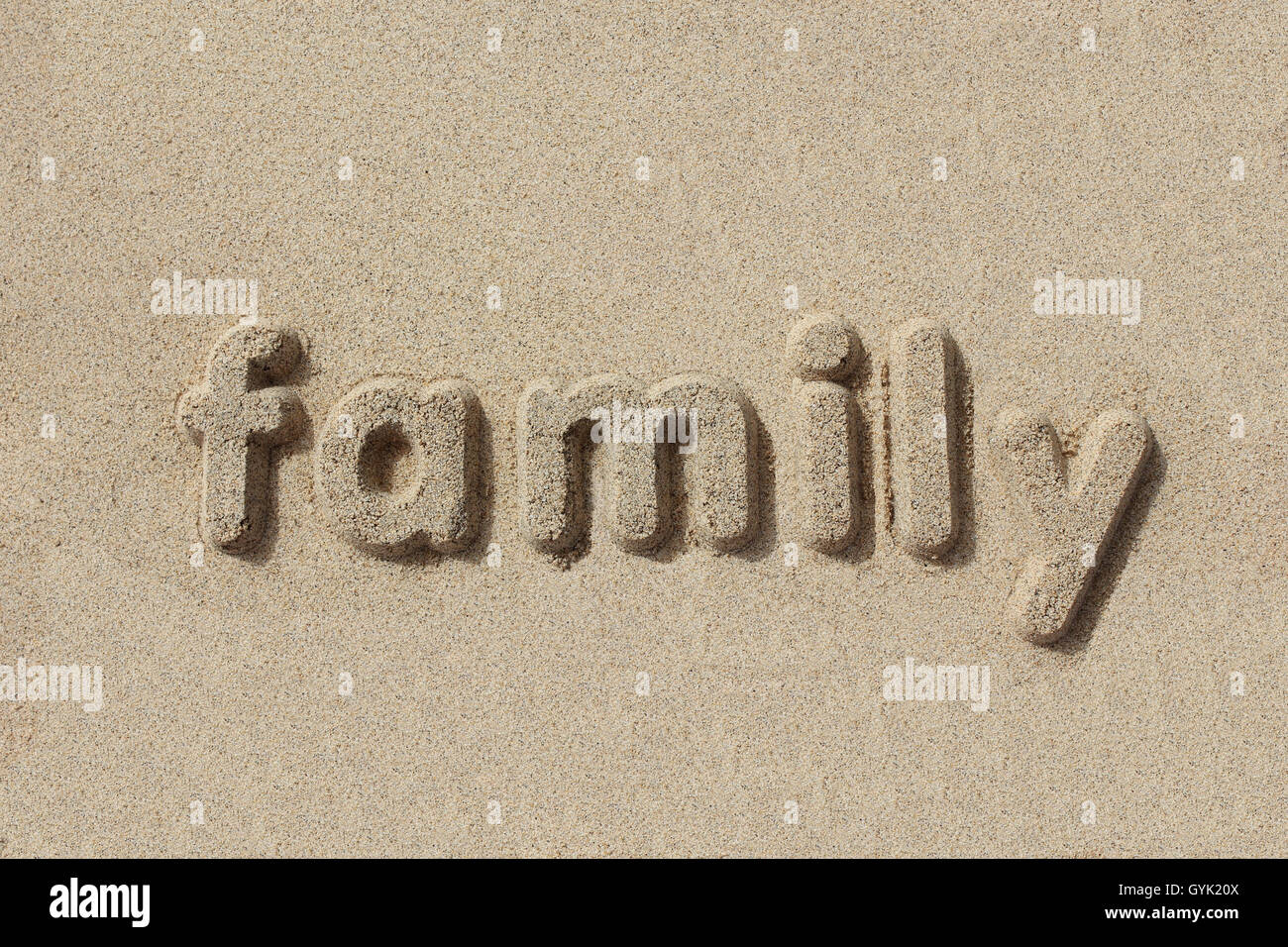 Family written in sand letters. Very simple and graphic Stock Photo - Alamy