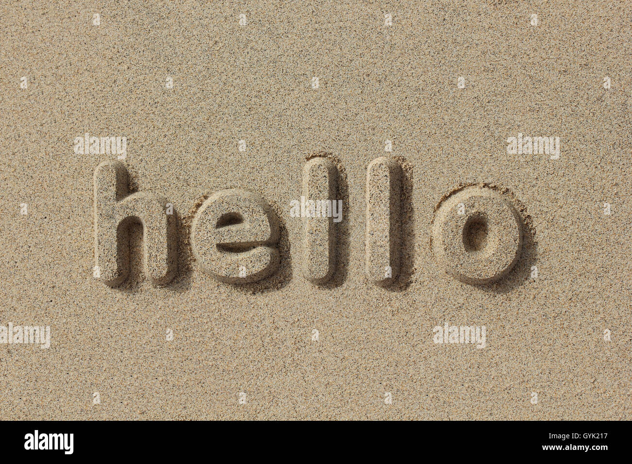 Hello written in sand letters. Very simple and graphic Stock Photo - Alamy