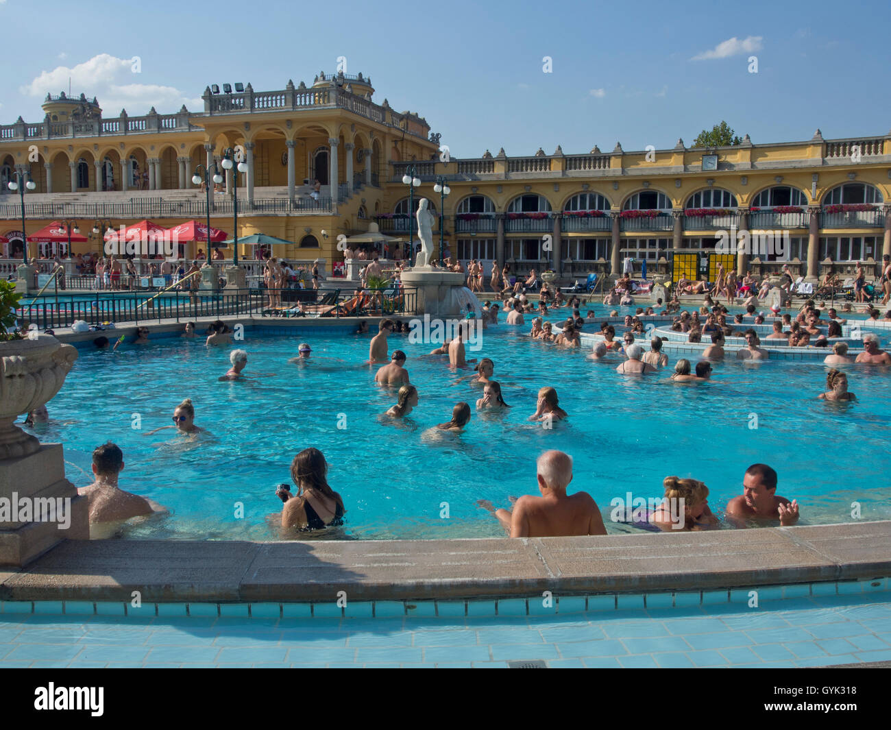 People enjoy the outdoor pools at the Szechenyi thermal baths.Budapest ...