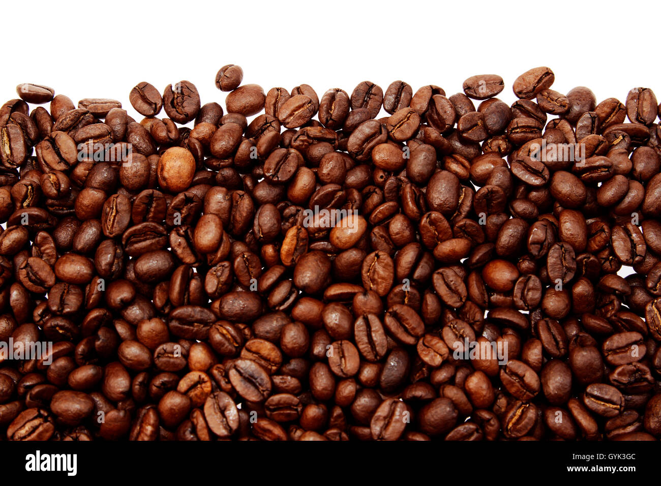 Closeup of coffee beans on plain background Stock Photo - Alamy