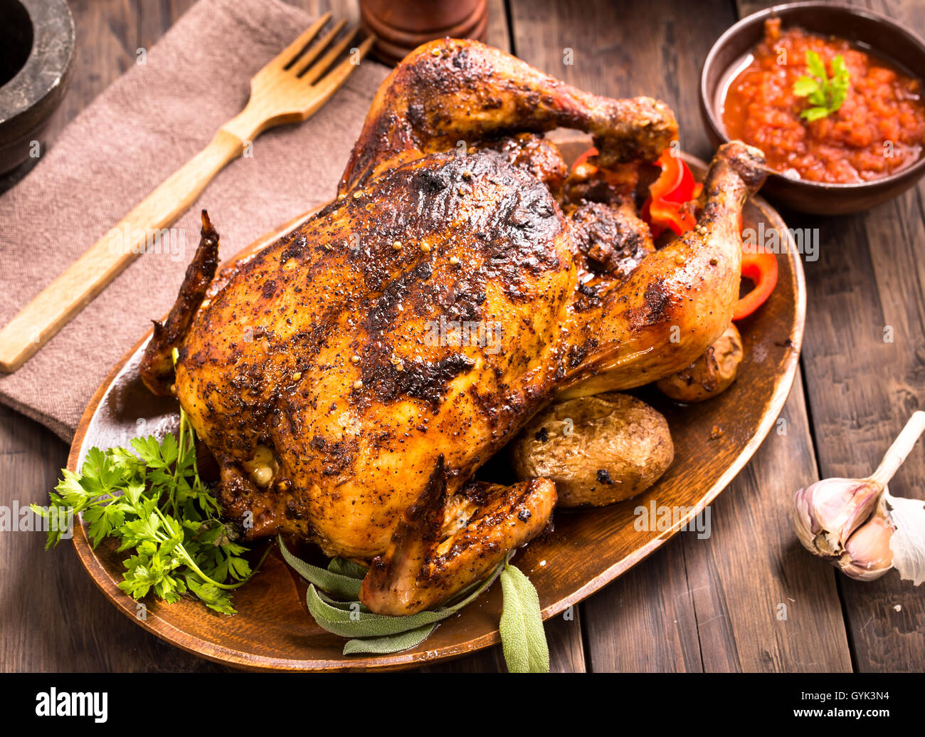 Roasted chicken on wooden plate Stock Photo - Alamy
