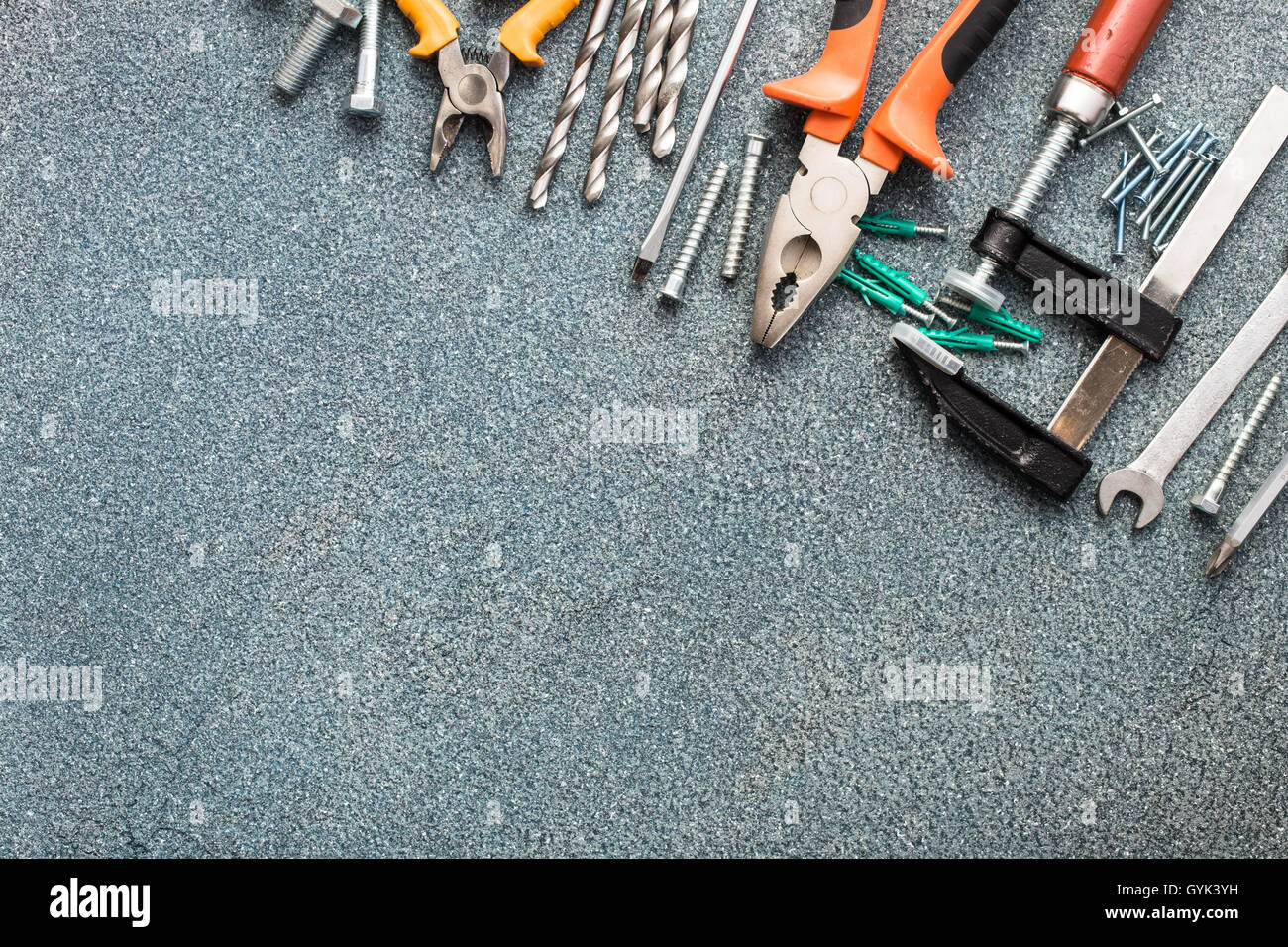 Set of tools over gray stone texture Stock Photo - Alamy