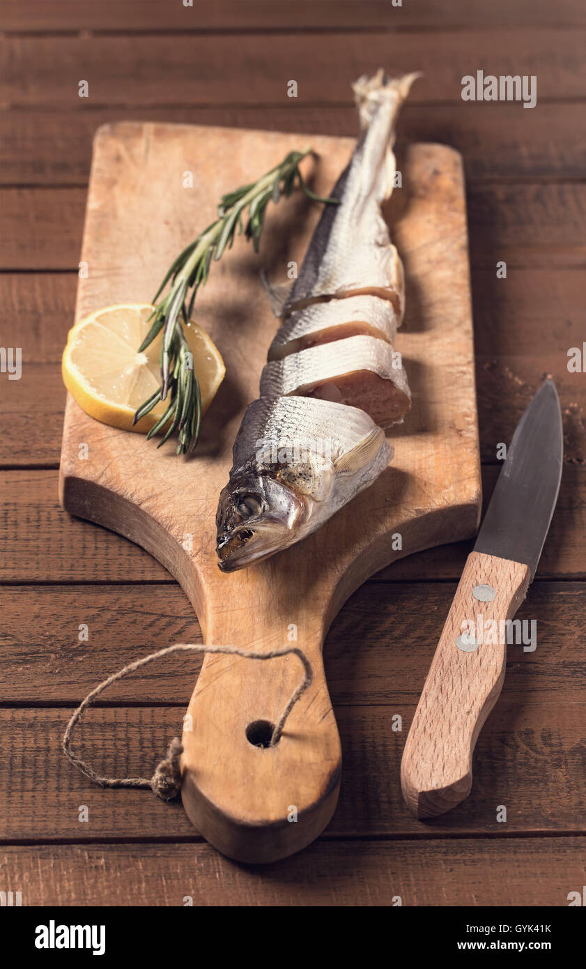 Sliced fish on cutting board Stock Photo - Alamy
