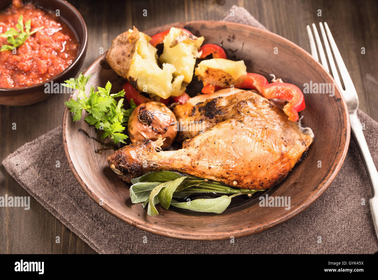 Spicy roasted chicken leg on plate Stock Photo - Alamy