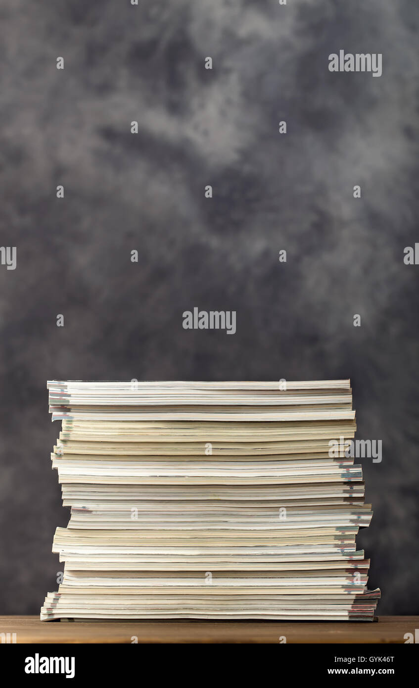 Stack of magazines on table Stock Photo - Alamy