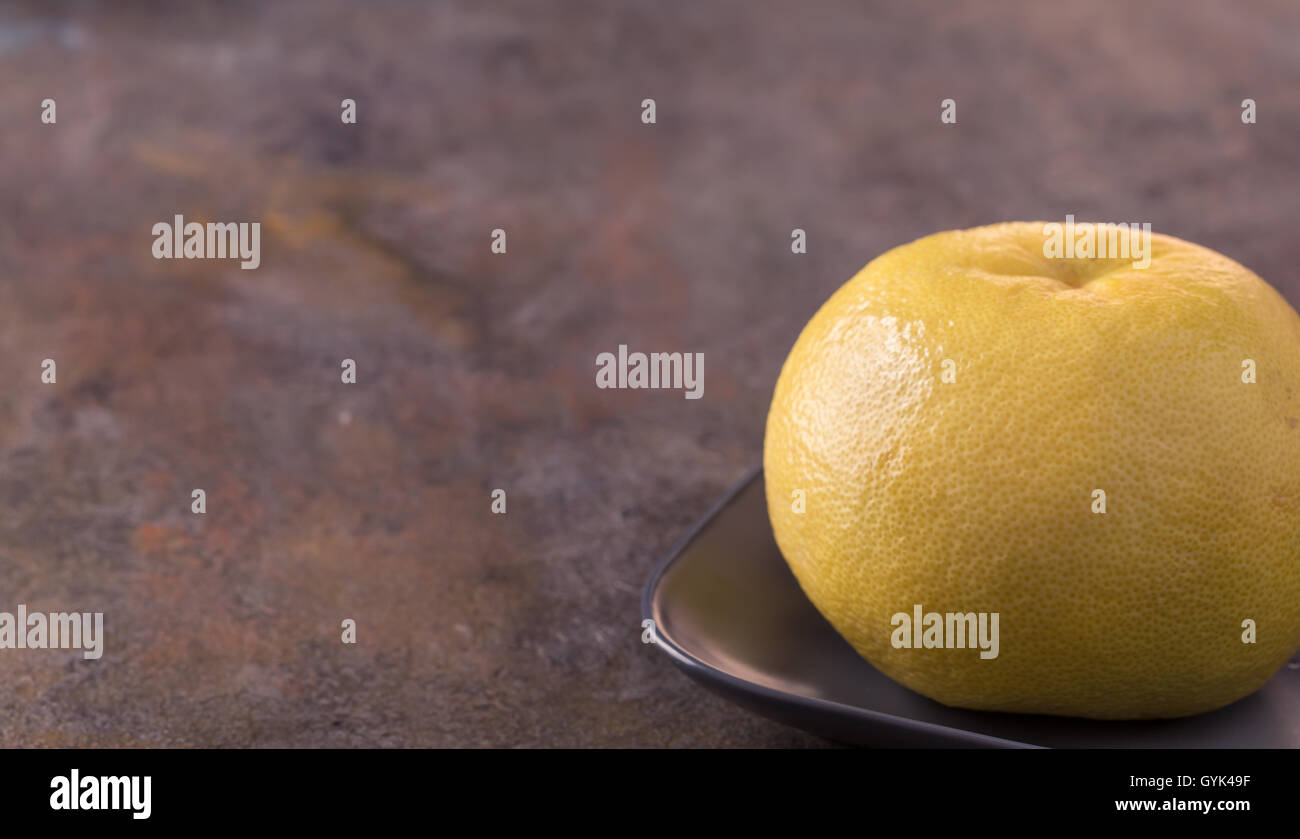 Sweetie on plate from right side of old background Stock Photo - Alamy