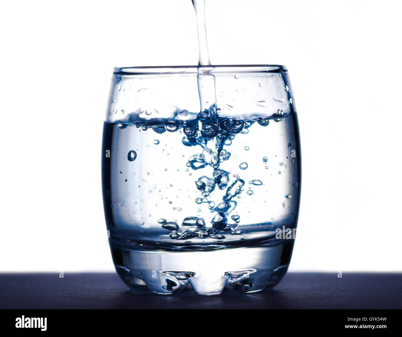 water splashing from glass isolated on white background Stock Photo - Alamy